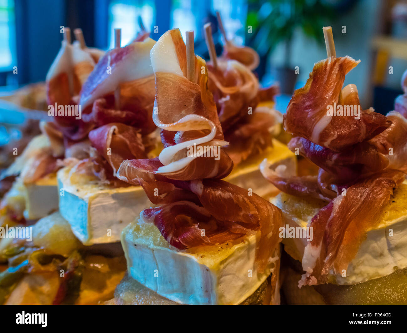 Tipical spanish tapa of iberic ham and cheese. Food in spanish bars ...