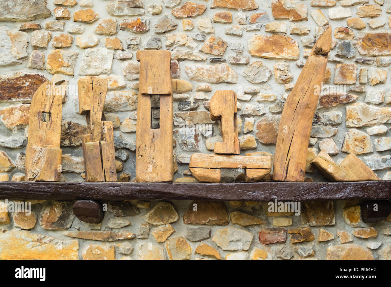 Wooden made construction objects on a stone wall. Background Stock ...