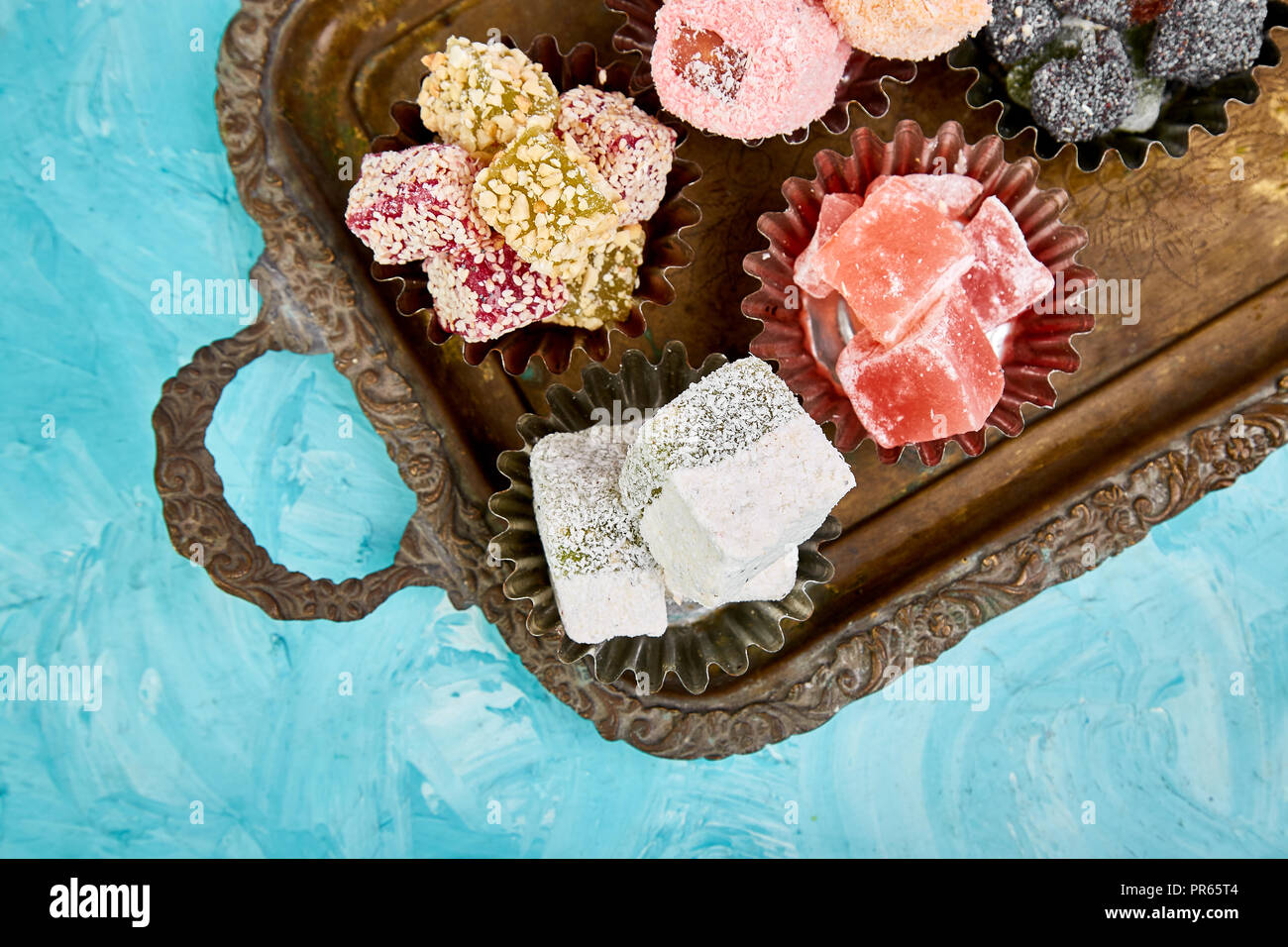 Set of various Turkish delight in a copper plate on metal tray blue ...