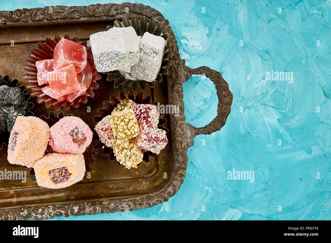 Set of various Turkish delight in a copper plate on metal tray blue ...
