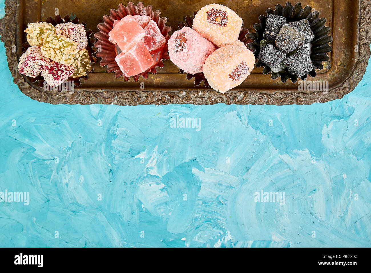 Set of various Turkish delight in a copper plate on metal tray blue ...