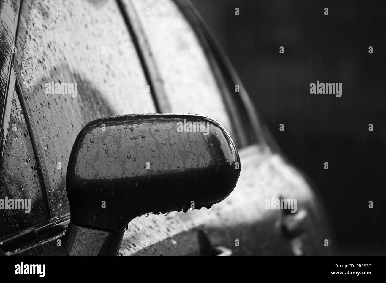 Black car side mirror rain hi-res stock photography and images - Alamy