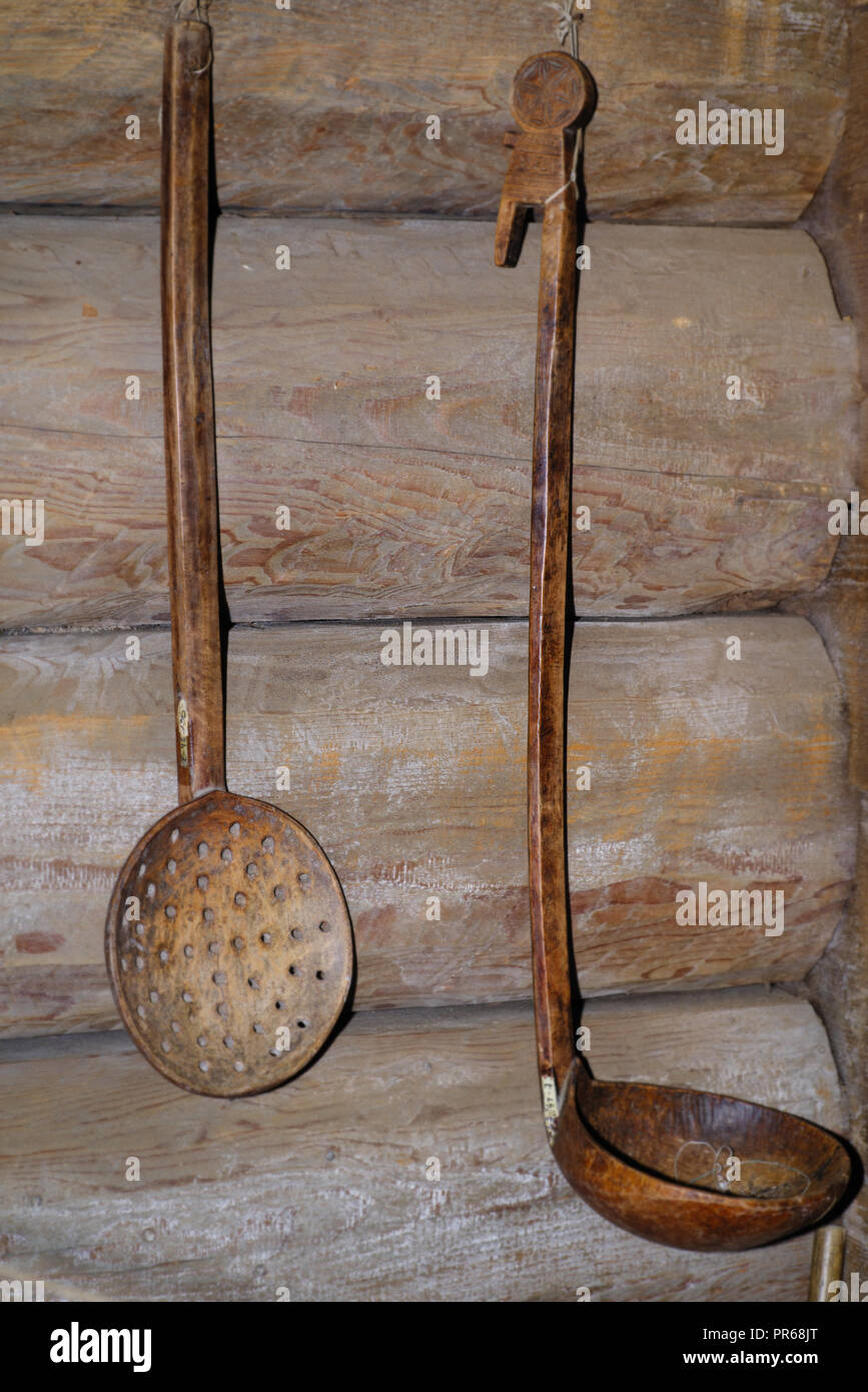 Antique antique wooden big fans are hanging on the background of a ...