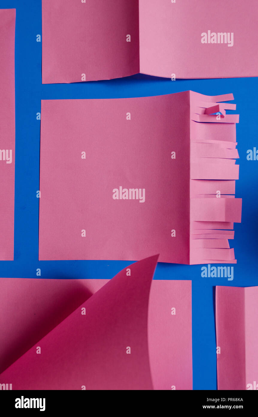 Pink paper cutouts on an isolated blue background, three-dimensional ...
