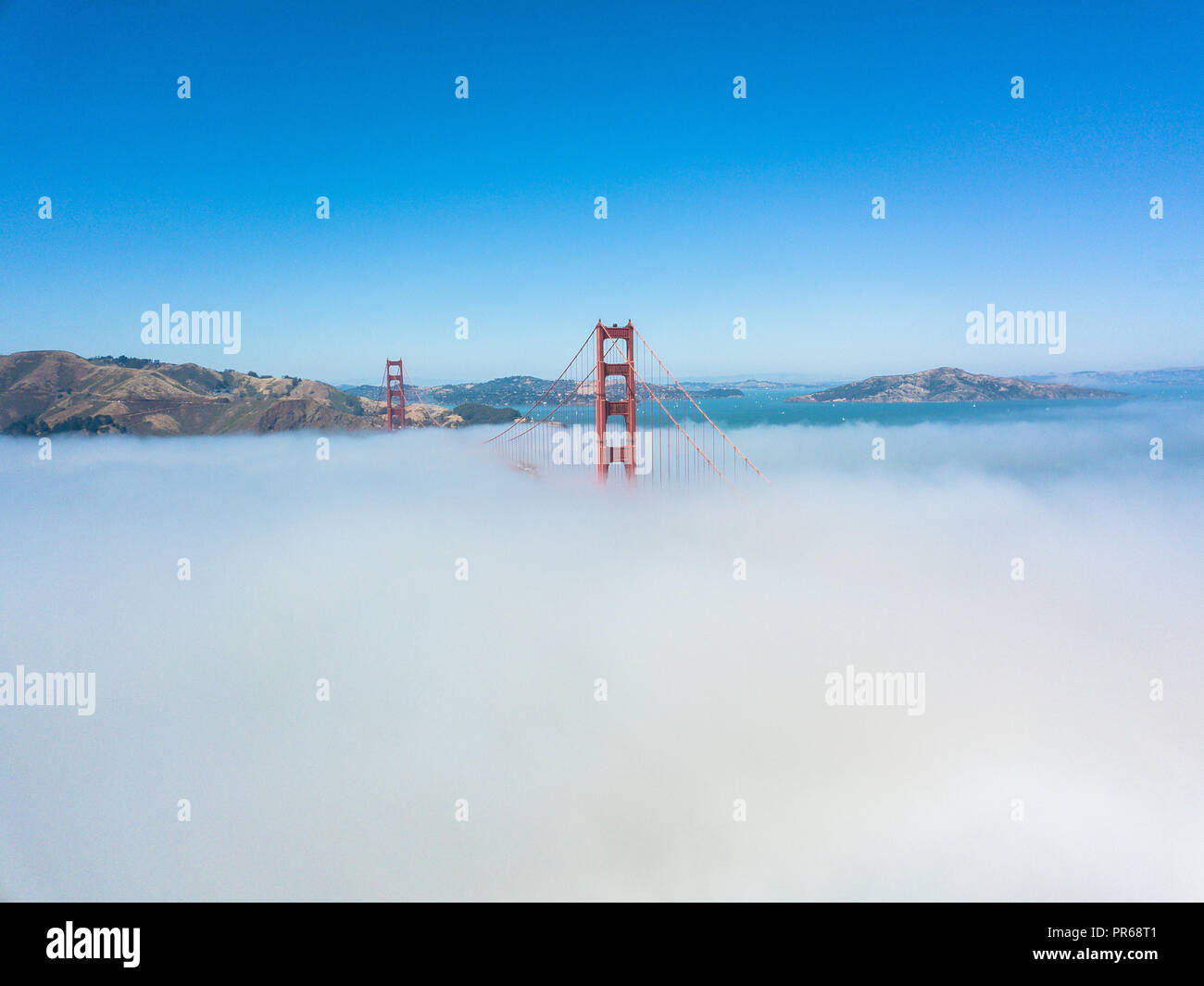 Golden Gate Bridge covered in thick fog shot from above Stock Photo - Alamy