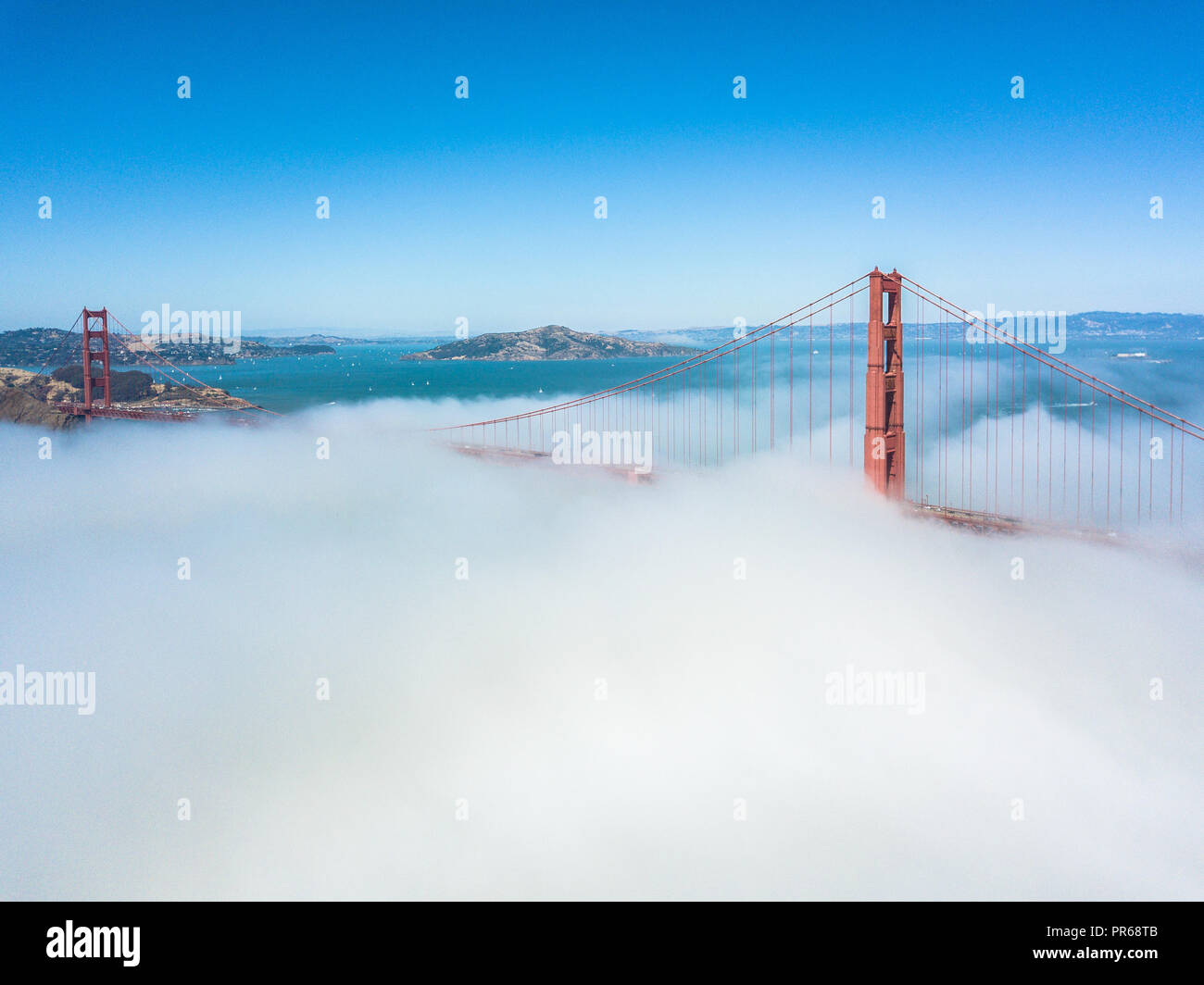 Golden Gate Bridge covered in thick fog shot from above Stock Photo - Alamy