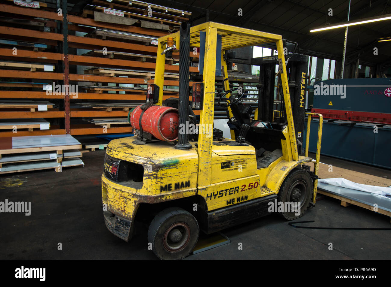 Fork lift truck in metal Factory Stock Photo - Alamy