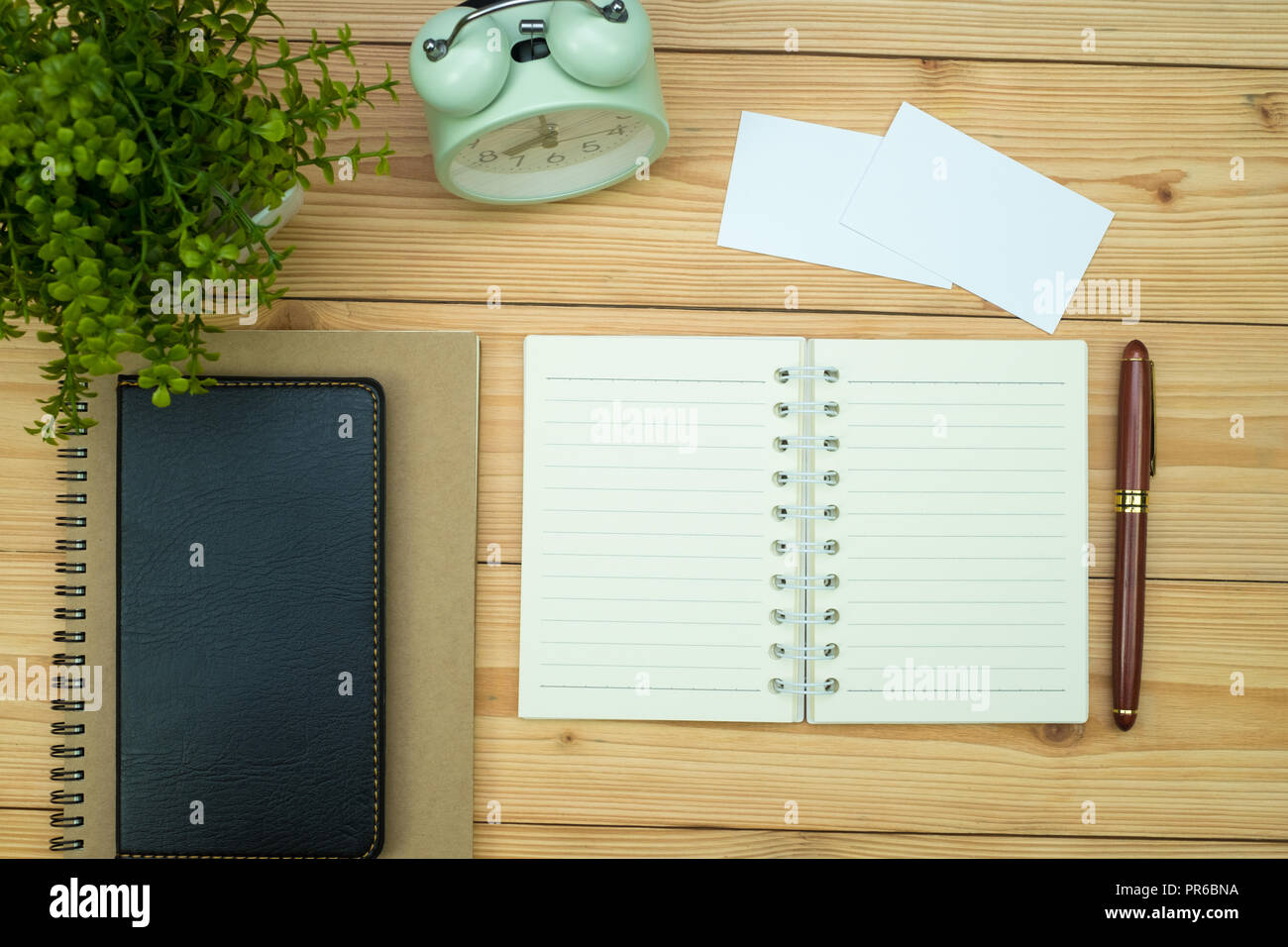 Office supplies or office work essential tools items on wooden desk in ...
