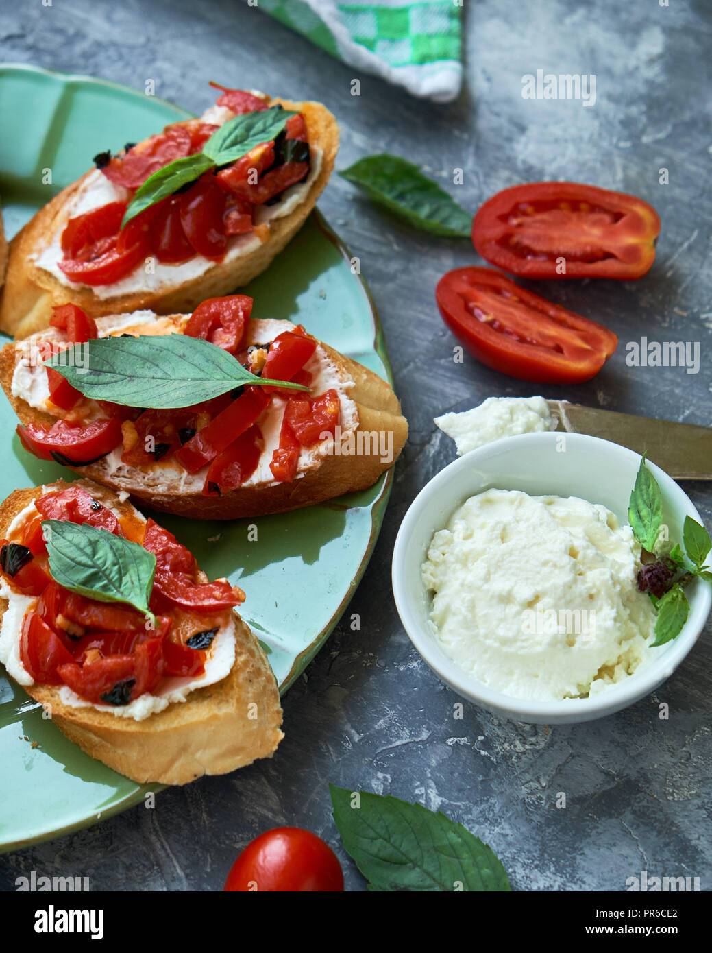 Italian bruschetta with chopped tomatoes, basil and cheese on grilled ...