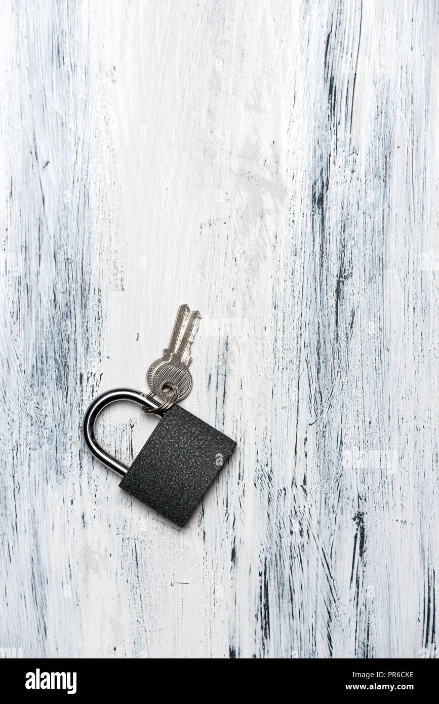 padlock and keys on white, wooden background, top view Stock Photo - Alamy