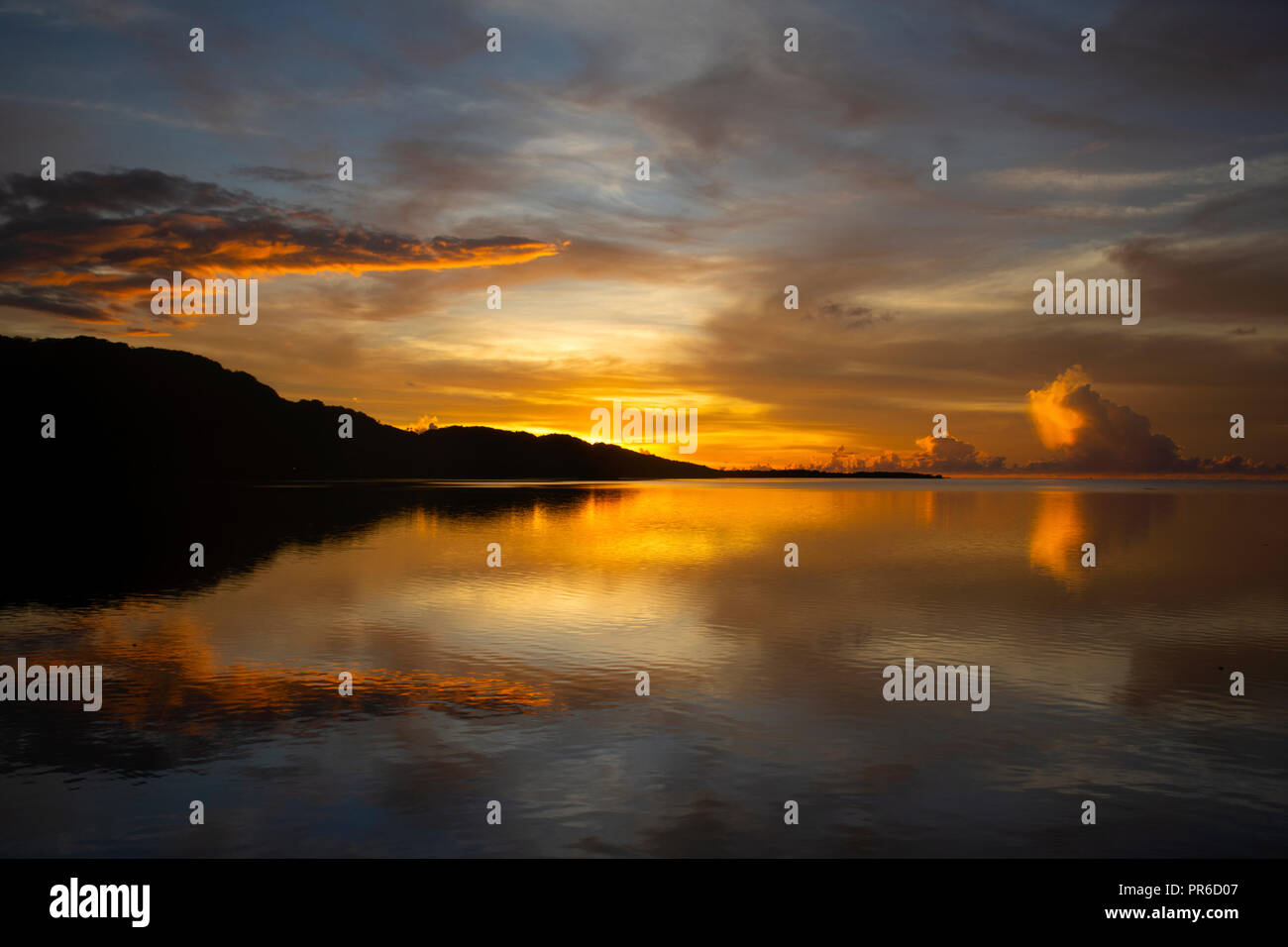 Golden sky with clouds at sunset, U district, Pohnpei, Federated States ...