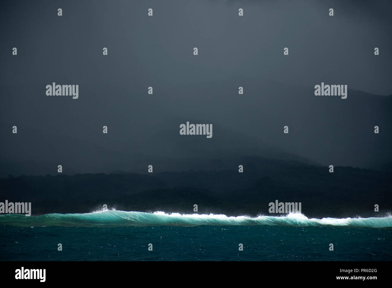 Wave breaks on a reef during a storm, Pohnpei, Federated States of ...