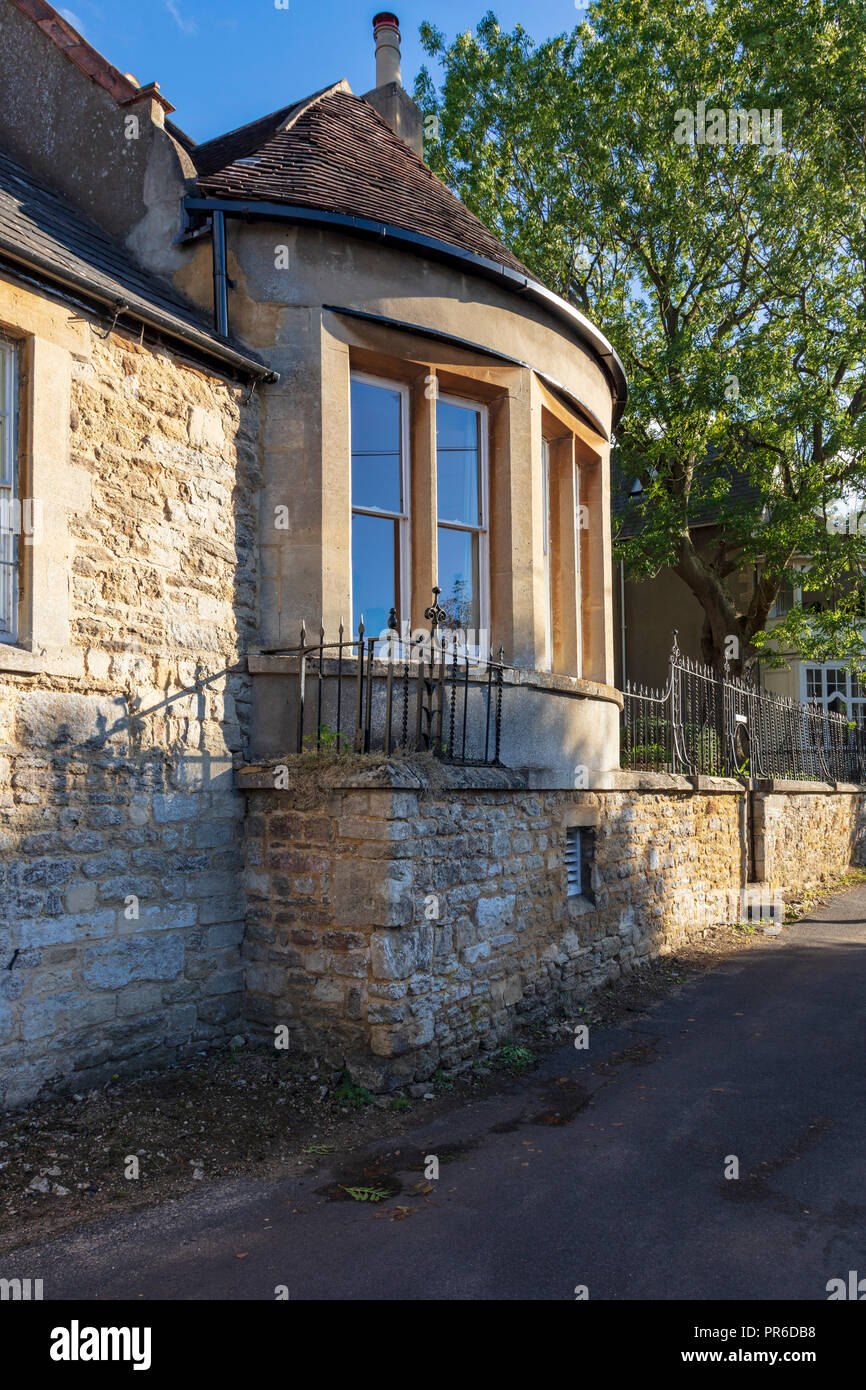 Attractive house bay window in Iffley village, lit by the low autumn ...