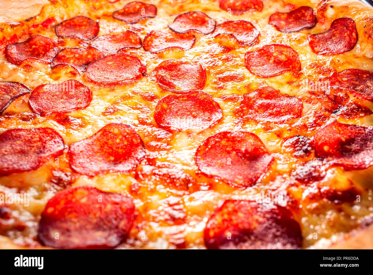 Appetizing background pepperoni pizza closeup filling the frame Stock ...
