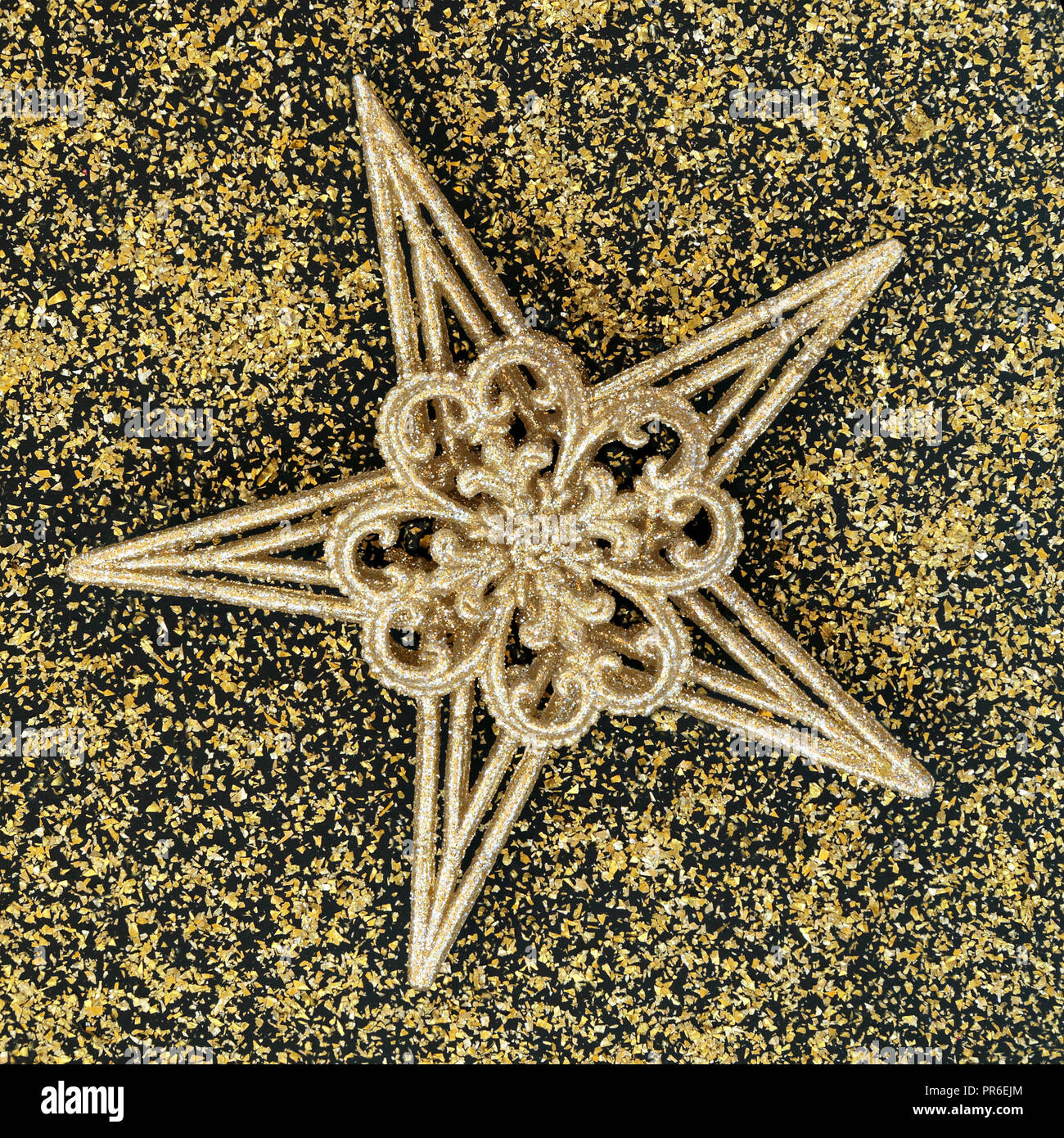 Christmas gold star bauble tree decoration with glitter background ...