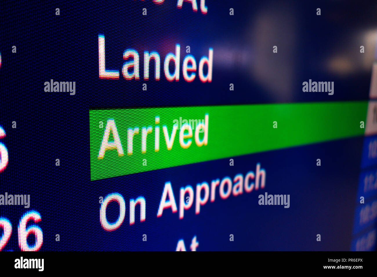 Flight Arrived information on sign at the Arrival Hall in Manchester ...