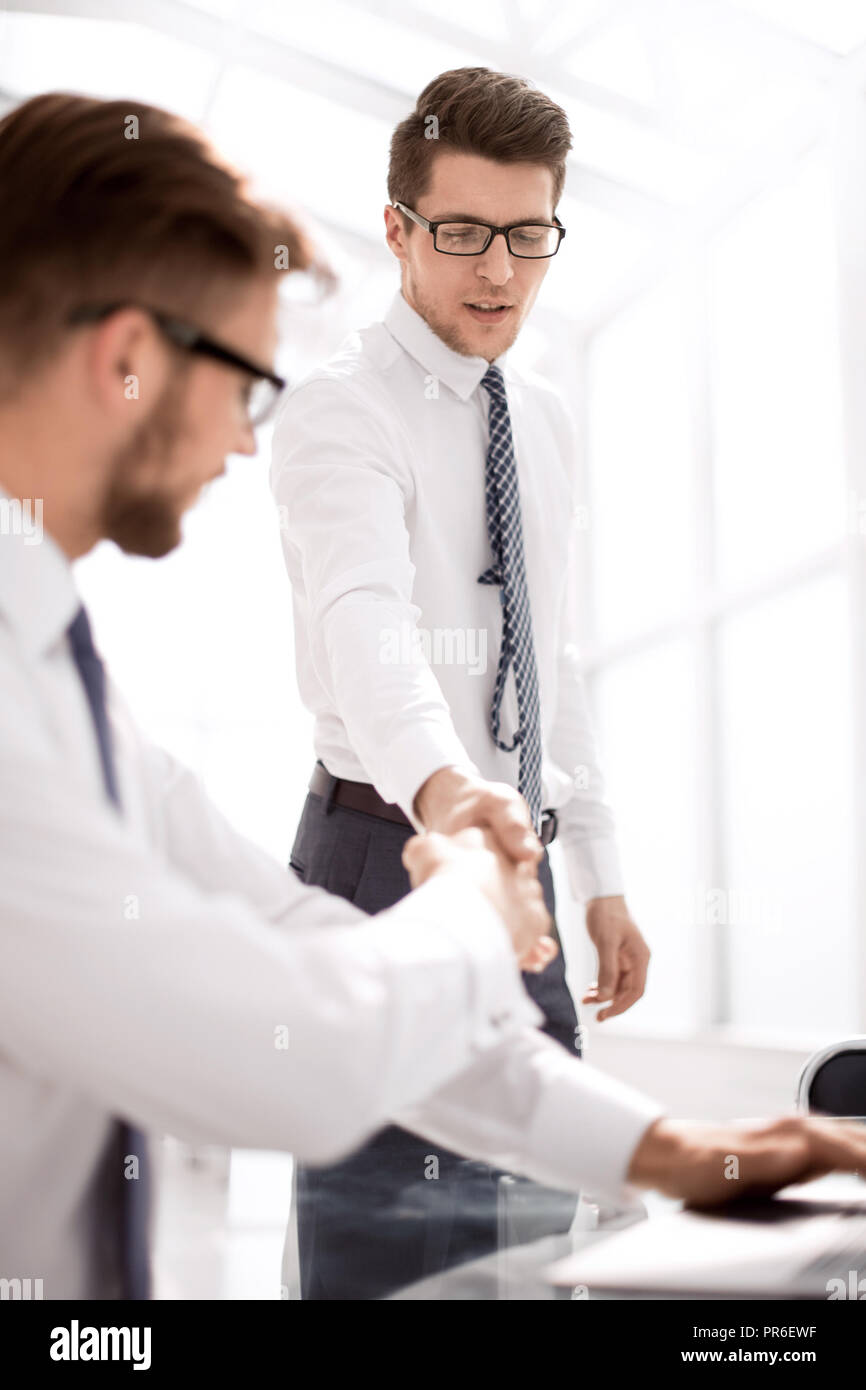 close up.handshake employees in the workplace Stock Photo - Alamy