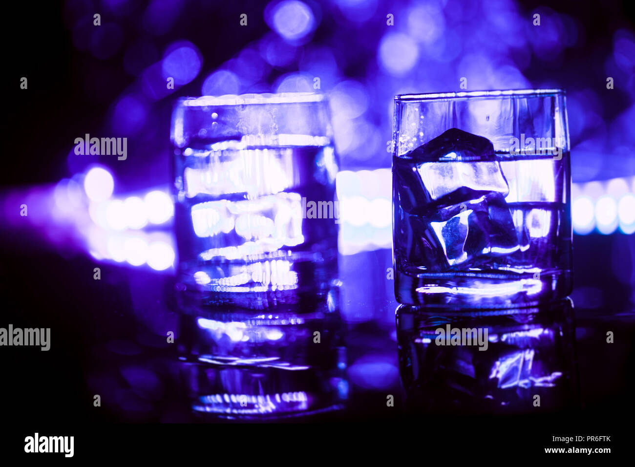 colored lighting of glasses in the night club bar Stock Photo - Alamy