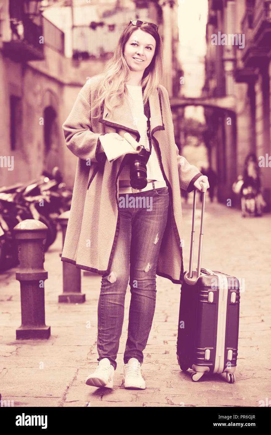 Happy smiling and inquisitive young girl taking a journey in the city Stock Photo - Alamy