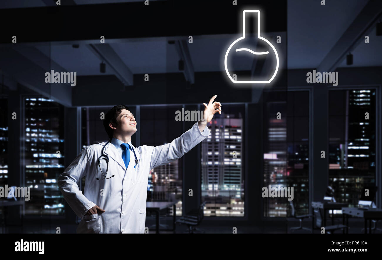 Doctor and medical vial symbol Stock Photo - Alamy