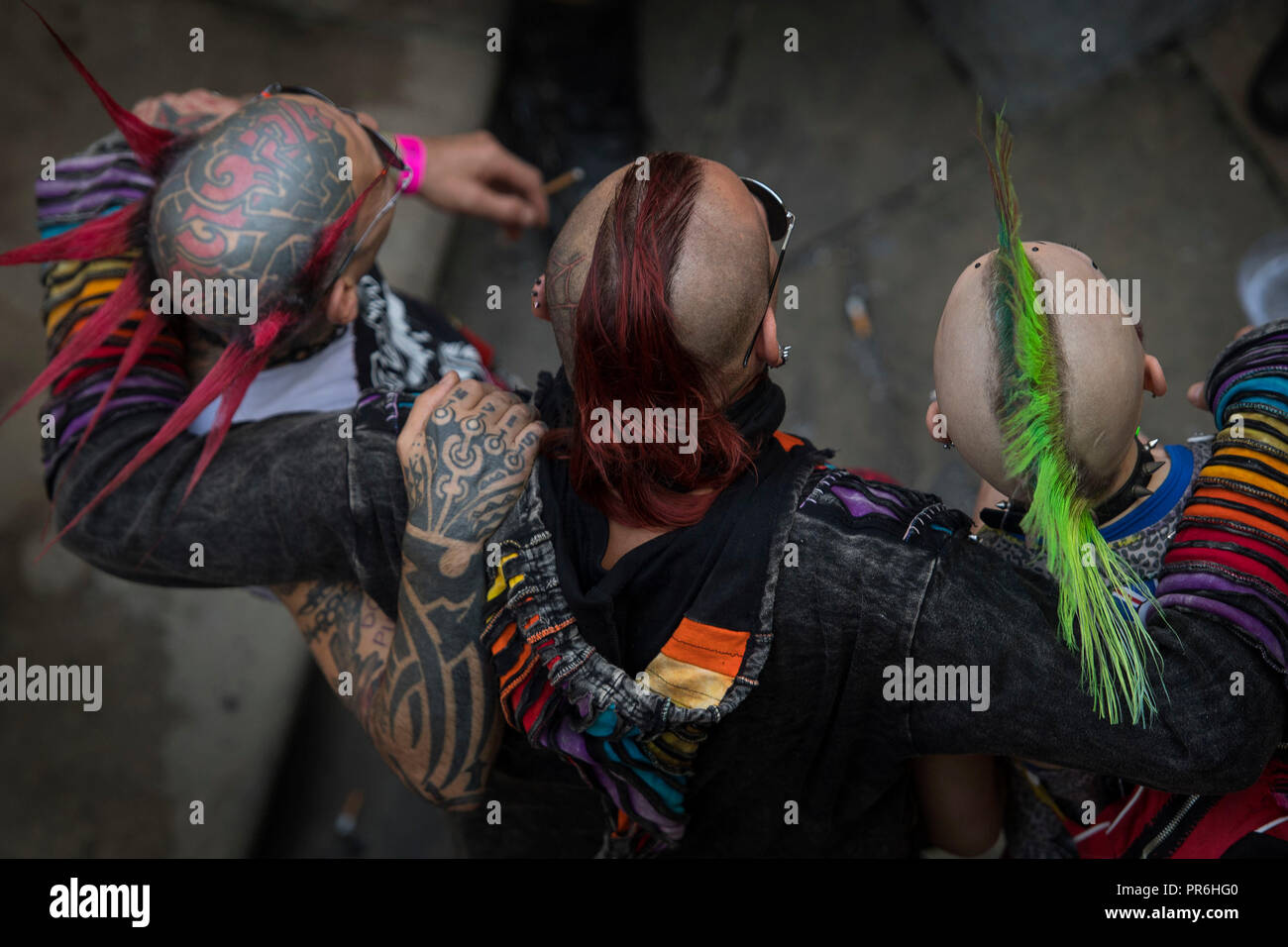 Men shows off their tattoos during the International tattoo convention ...