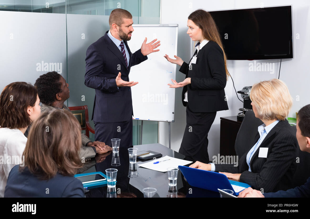 Outraged unhappy manager expressing his dissatisfaction to female ...