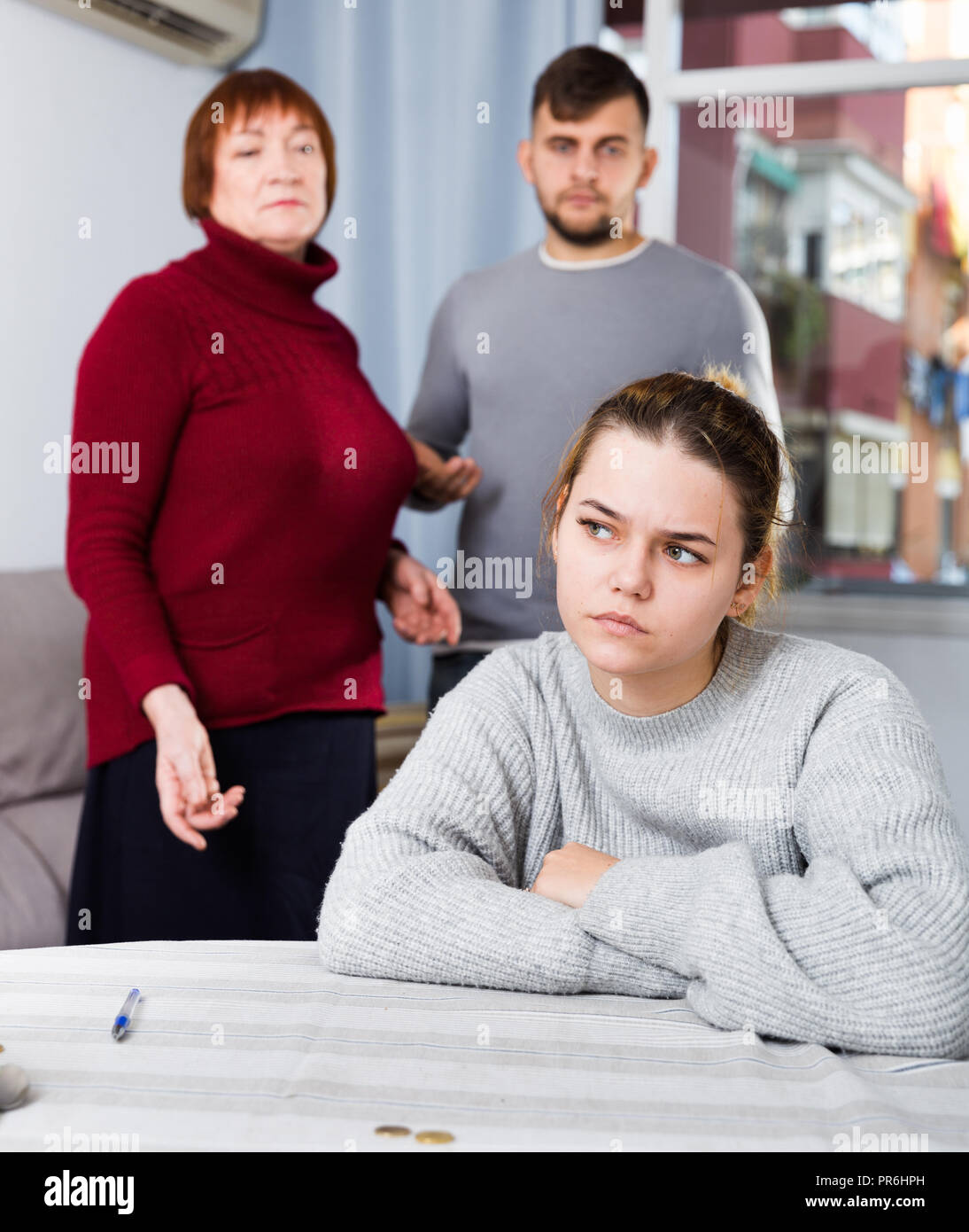 Frustrated girl sitting separately having problems in relationship with ...