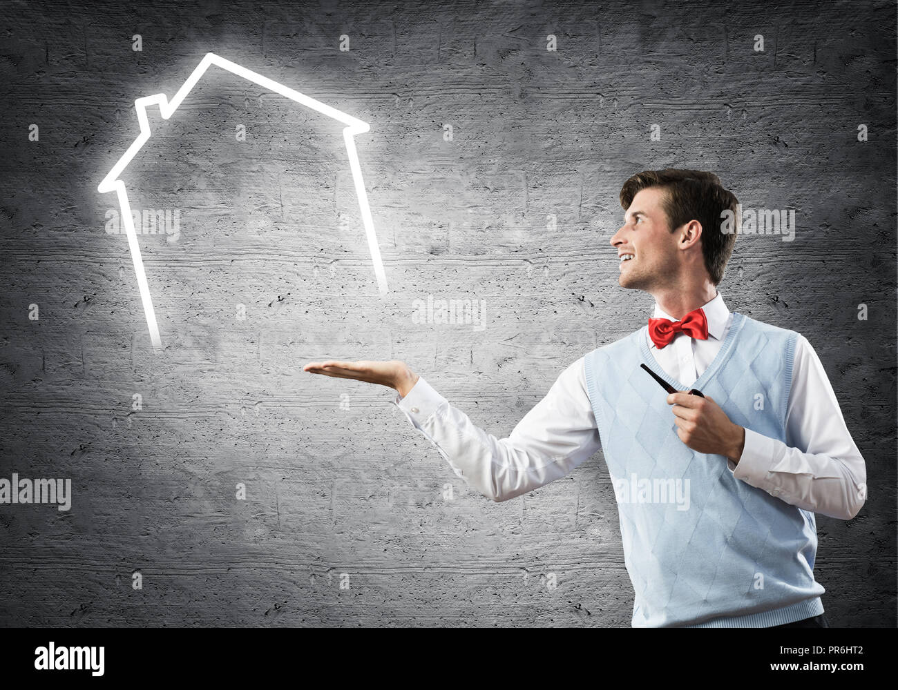 Elegant banker wearing red tie and house sign as banking concept Stock ...