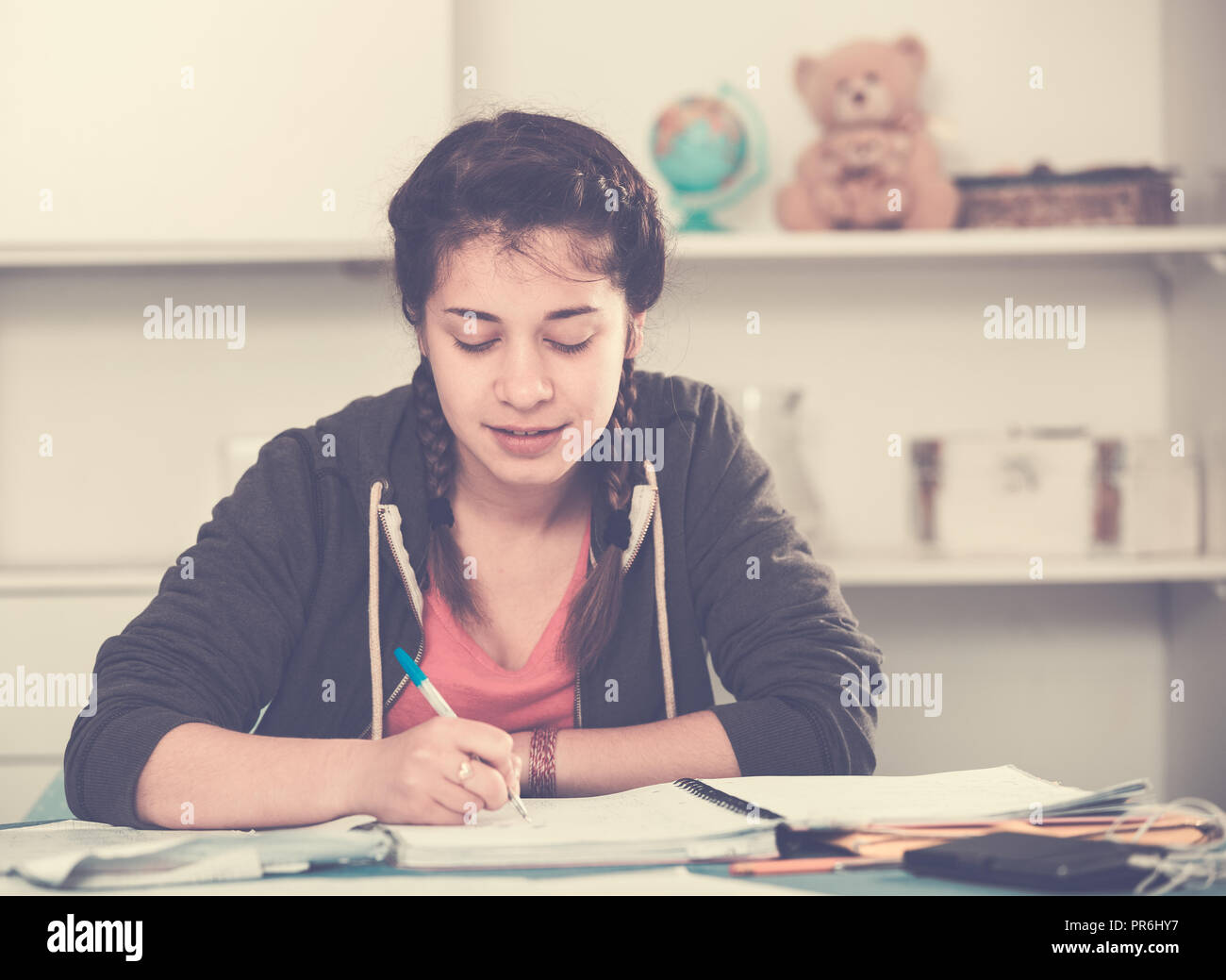 Female student having a productive day at studying at home Stock Photo ...