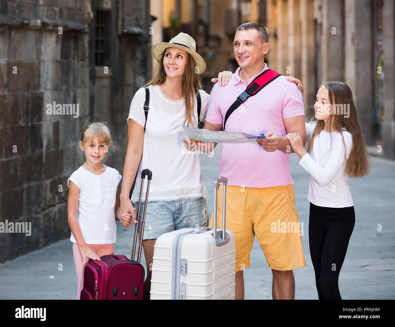 positive belgian parents with two kids traveling together searching ...