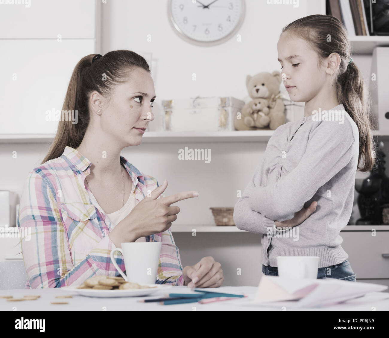 Young mother scolding her daughter for bad behavior and mistakes Stock Photo - Alamy