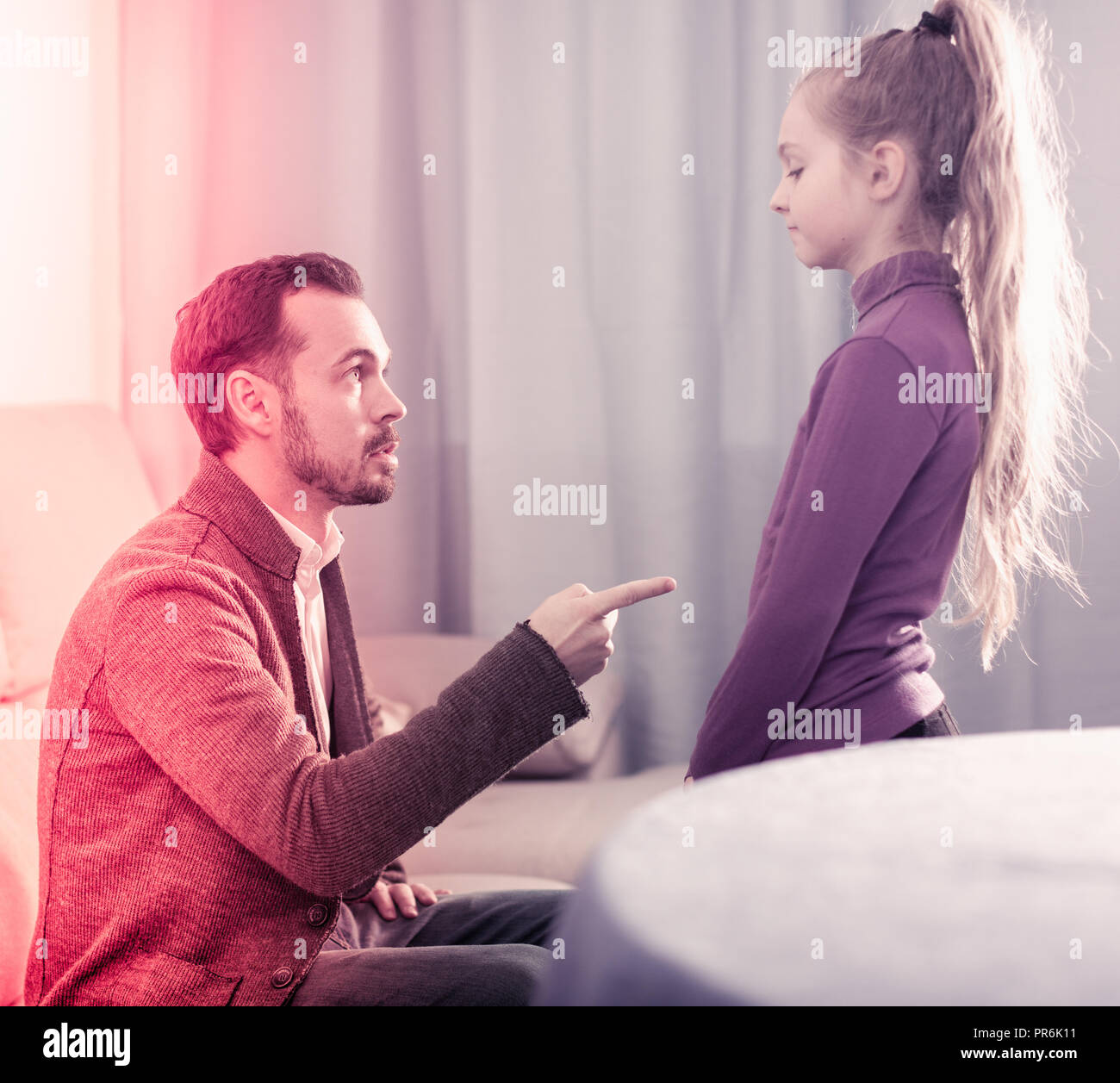 Young father and mother correcting their child for disobedience Stock ...