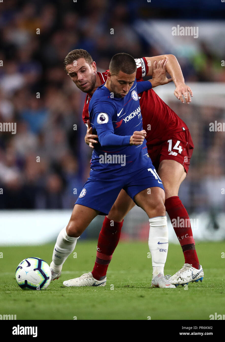 Chelsea's Eden Hazard (left) and Liverpool's Jordan Henderson battle ...