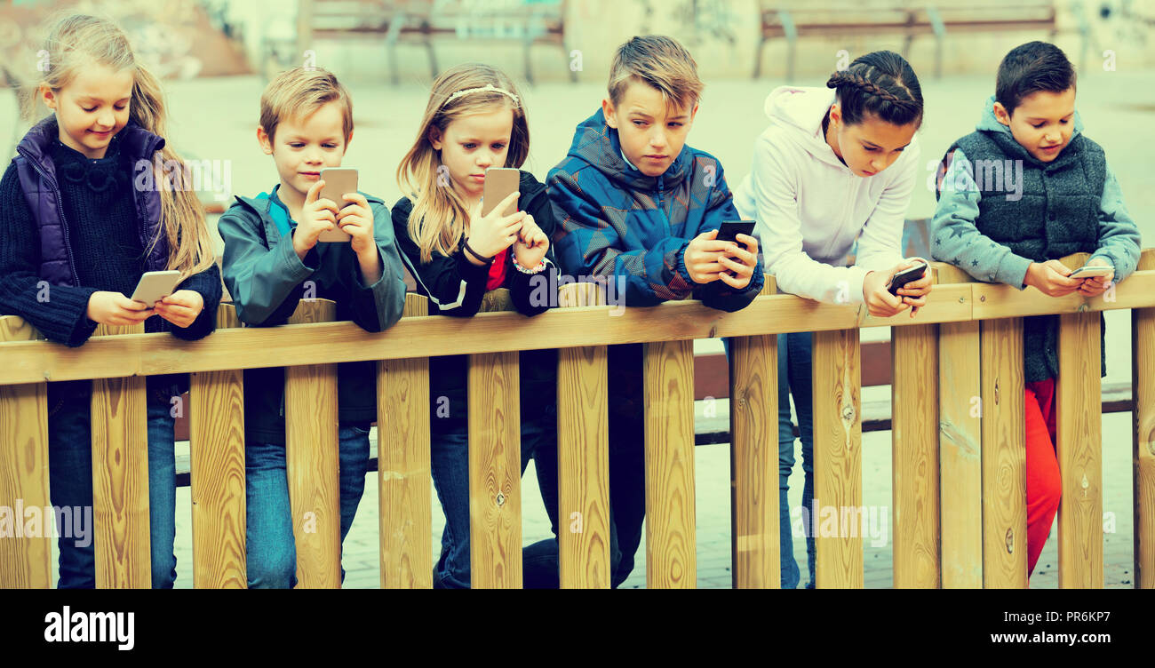 Happy children with tablets in street Stock Photo - Alamy