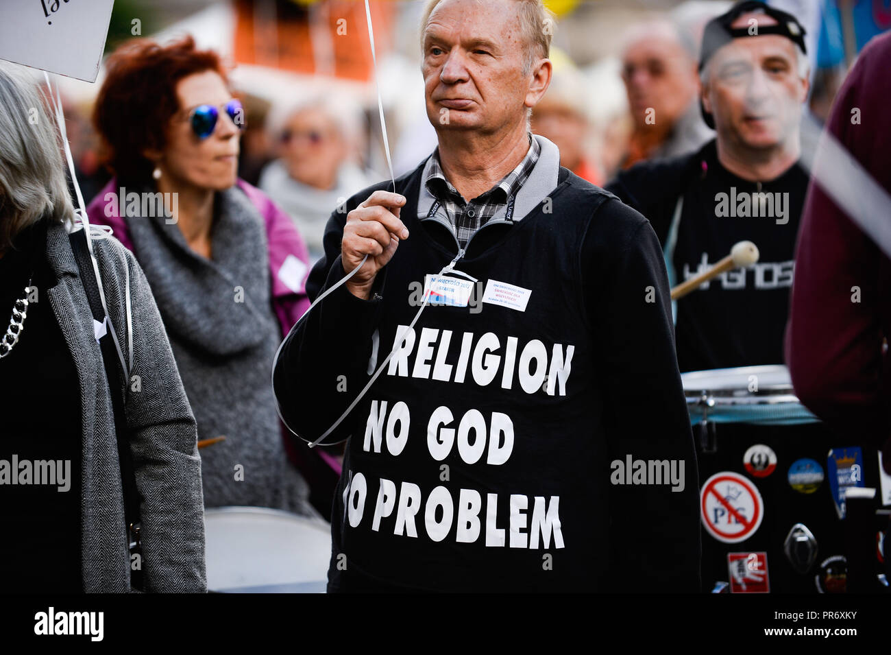 A man seen with a black shirt written No religion, No God, No Problem ...