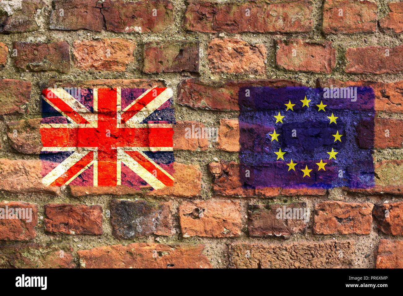 United Kingdom Union Jack and the European Union flags on a brick wall ...