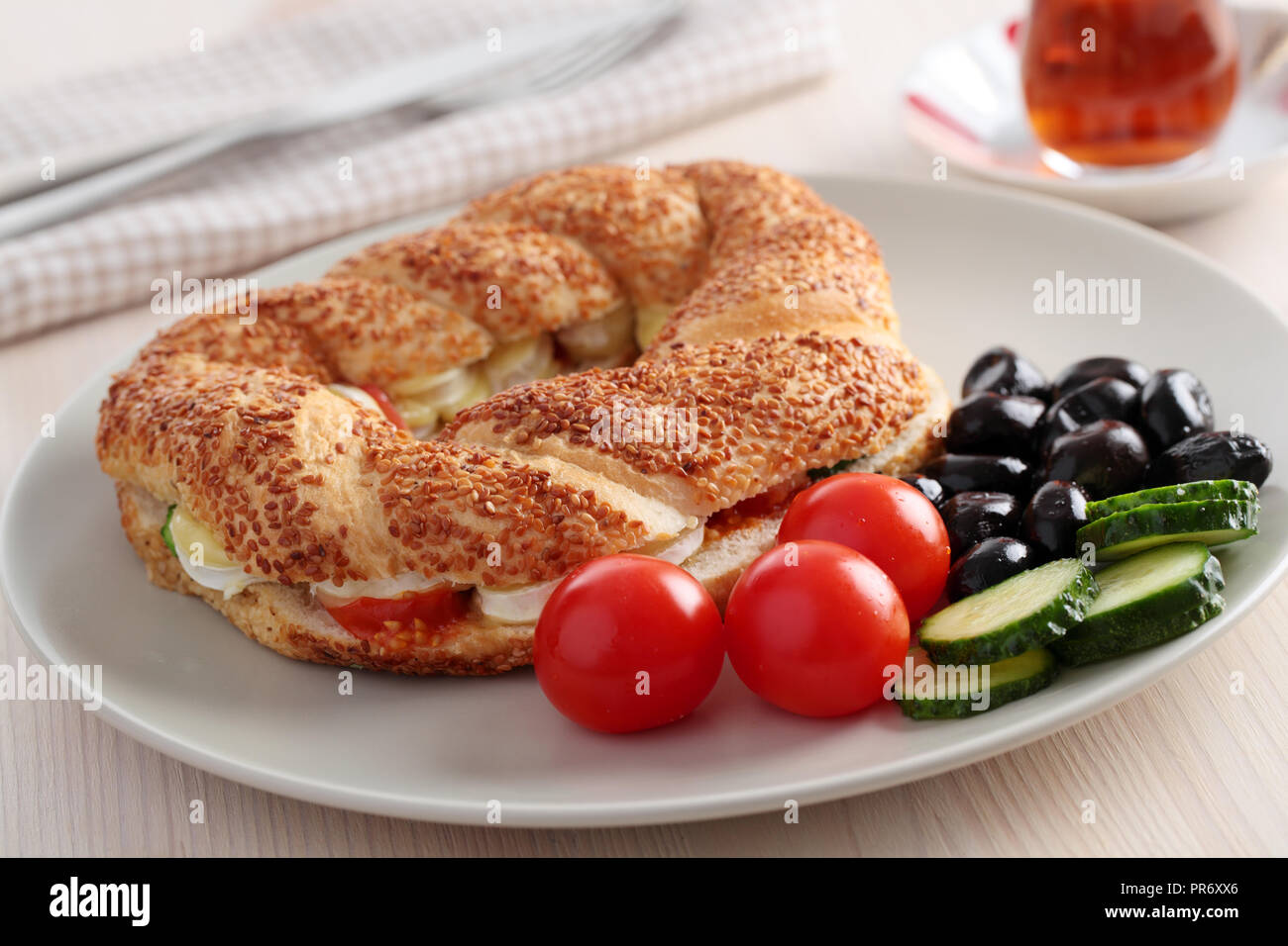 Turkish breakfast with simit, cheese, cherry tomato, cucumber, black ...