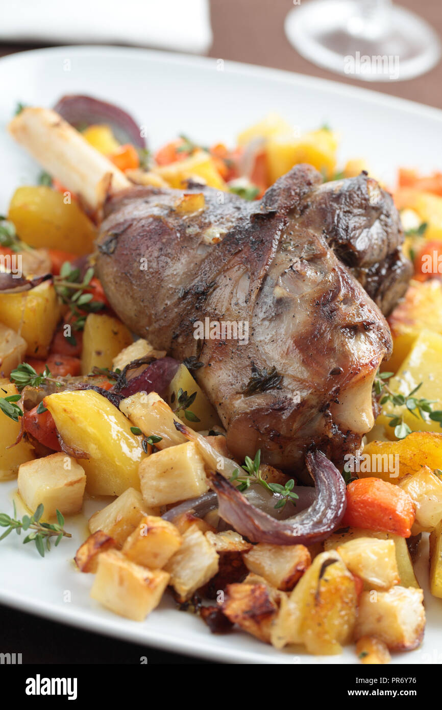 Roasted goose leg with vegetables Stock Photo - Alamy