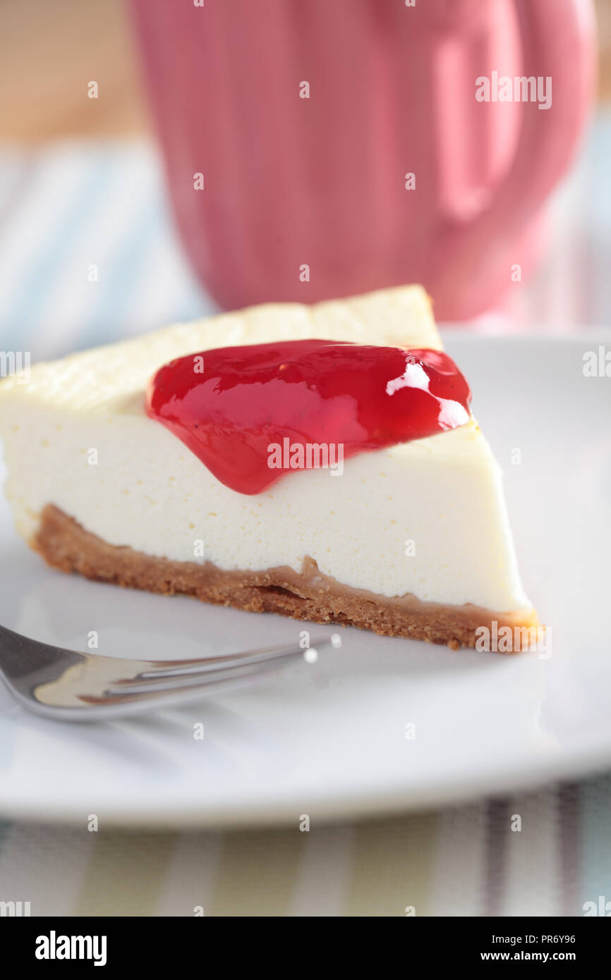 Cheesecake with jam on a plate Stock Photo - Alamy