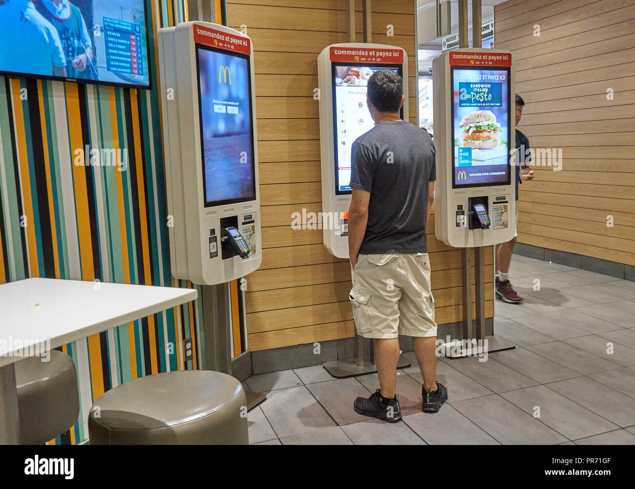 MONTREAL, CANADA - SEPTEMBER 8, 2018: A person in McDonalds at ...