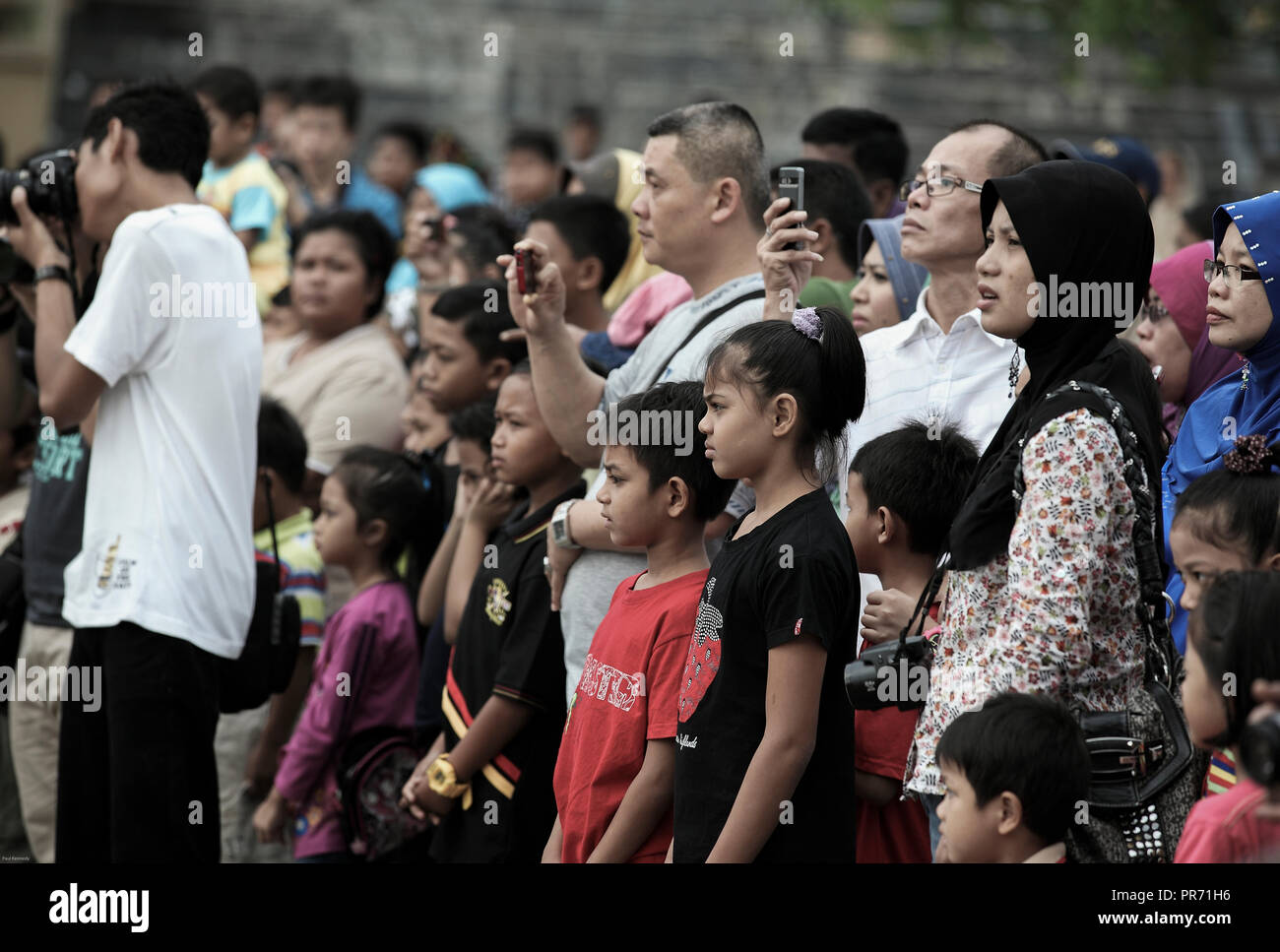 Crowd of people watching a public event in Malacca, Malaysia Stock ...