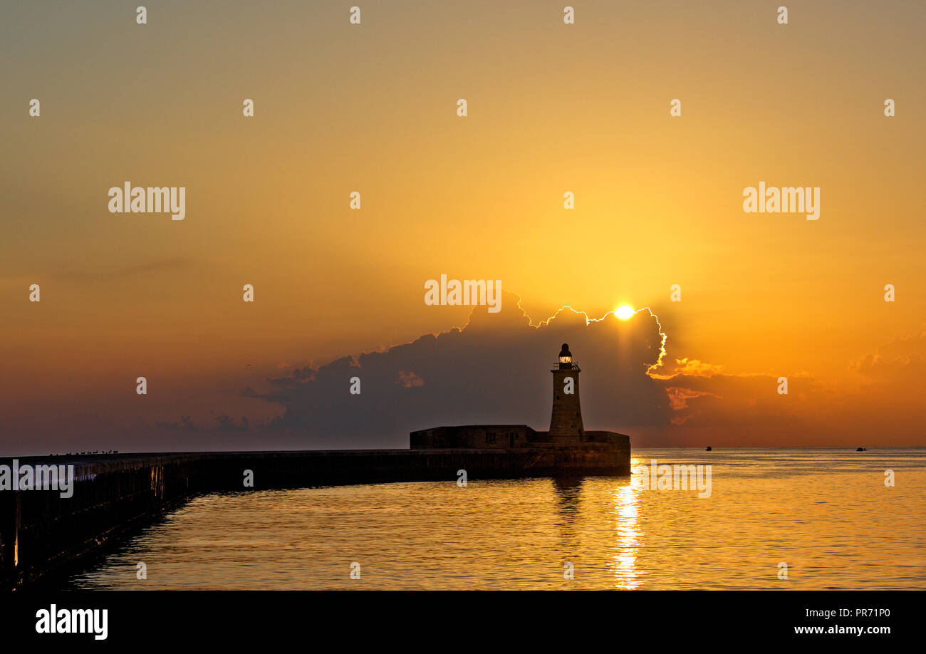 Sunrise in Valletta, Malta with boat in the background. Sunrise near ...