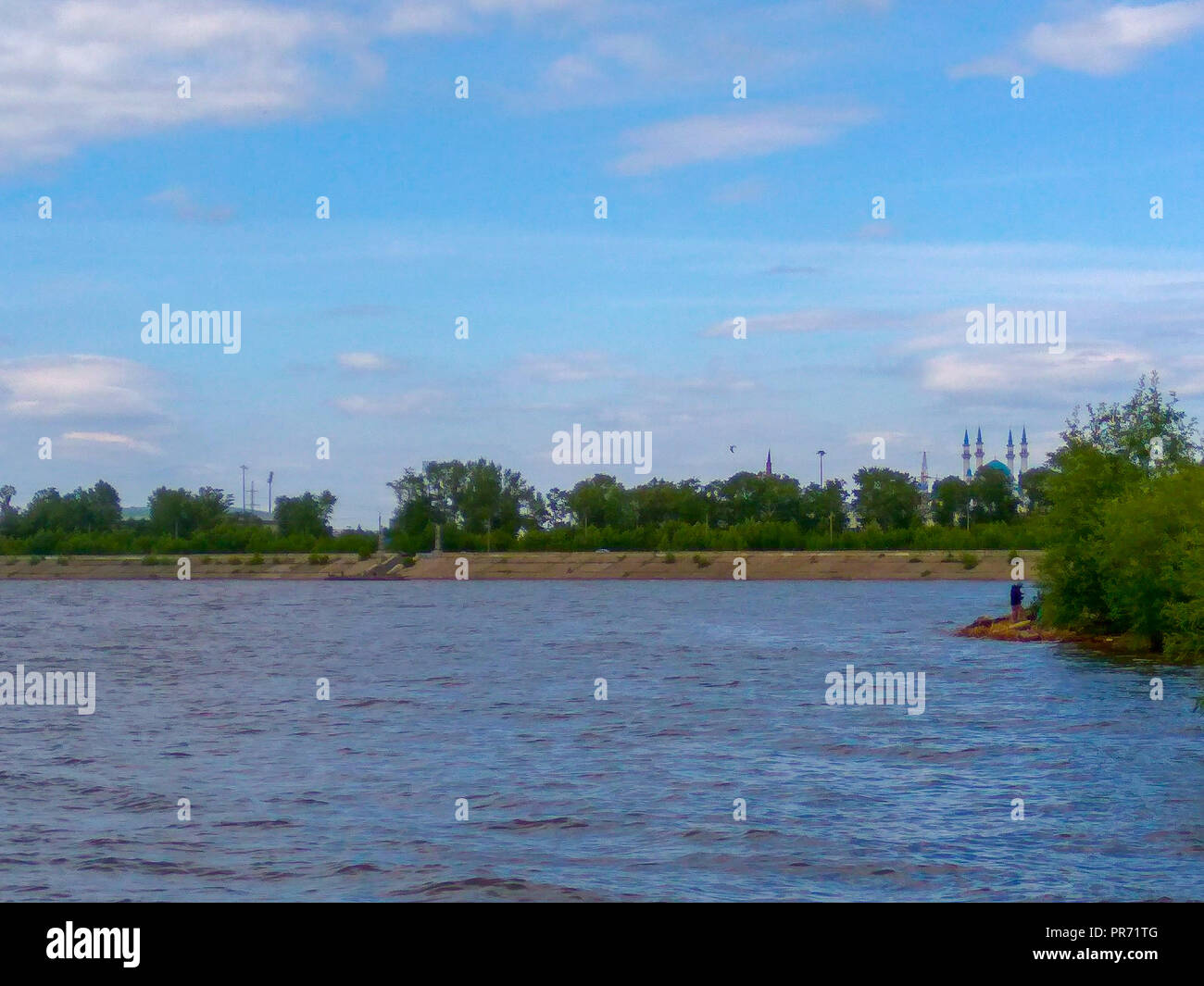 Riverside in clear weather and city on horizon Stock Photo - Alamy