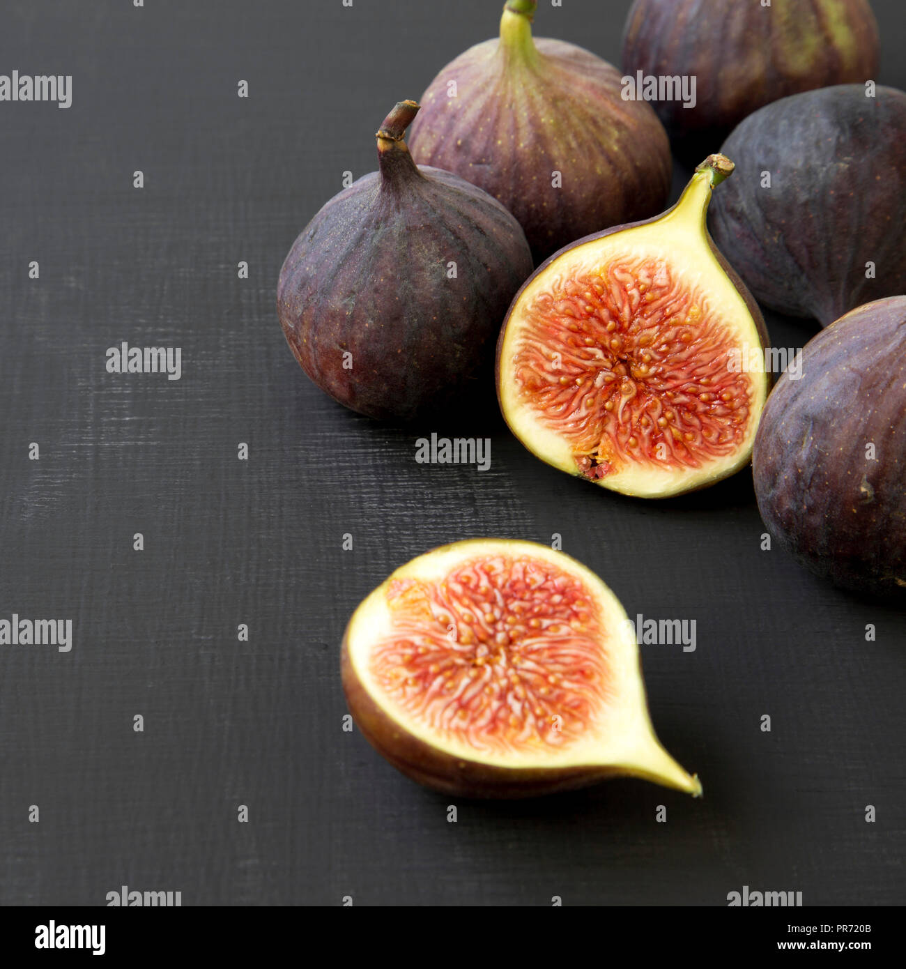 Fresh figs on black background, side view. Close-up Stock Photo - Alamy