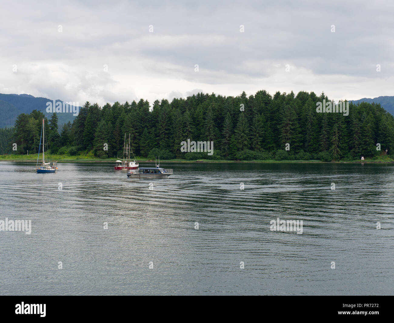 Boats On Calm Ocean Water In Alaska Stock Photo - Alamy