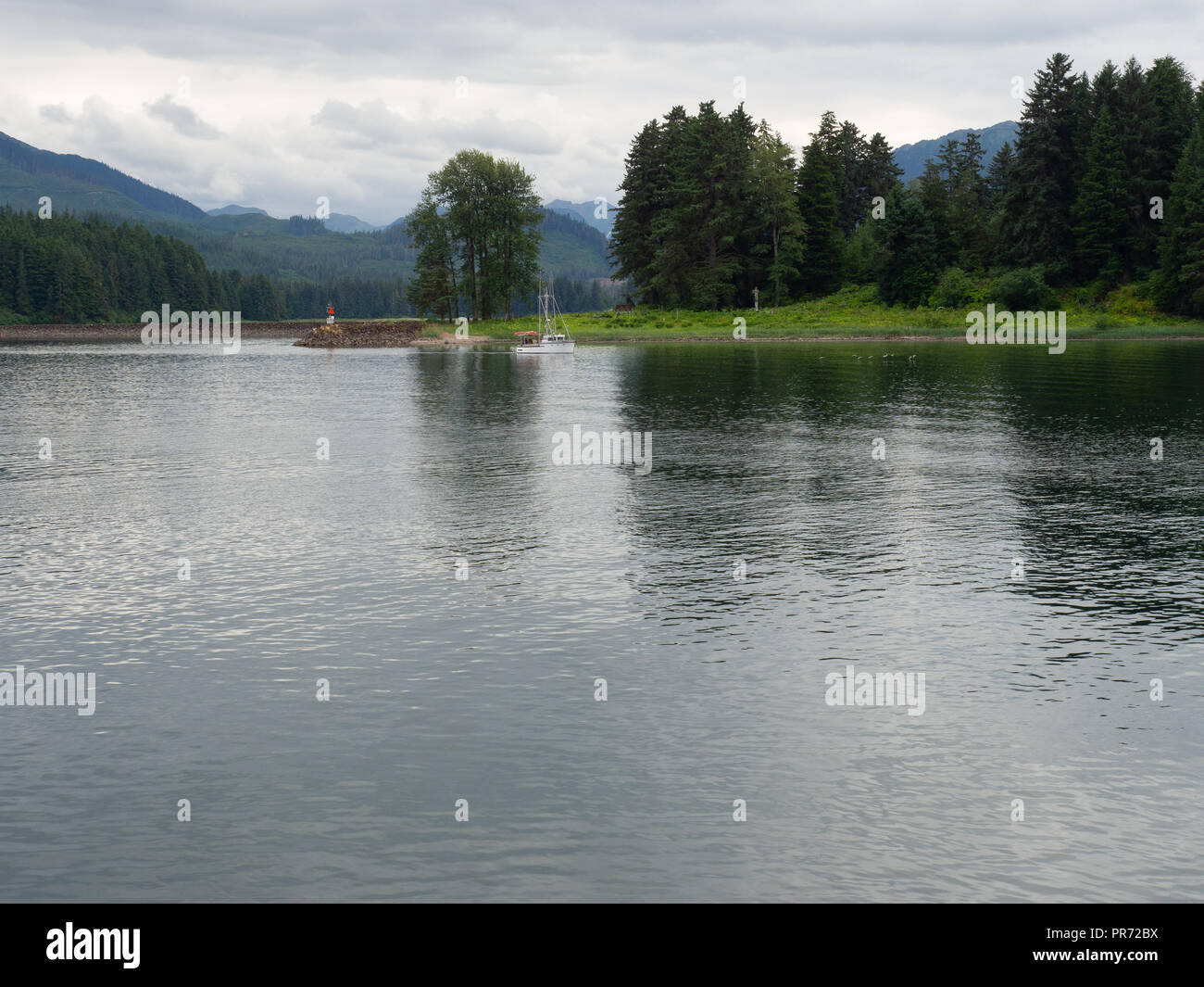 Boats On Calm Ocean Water In Alaska Stock Photo - Alamy