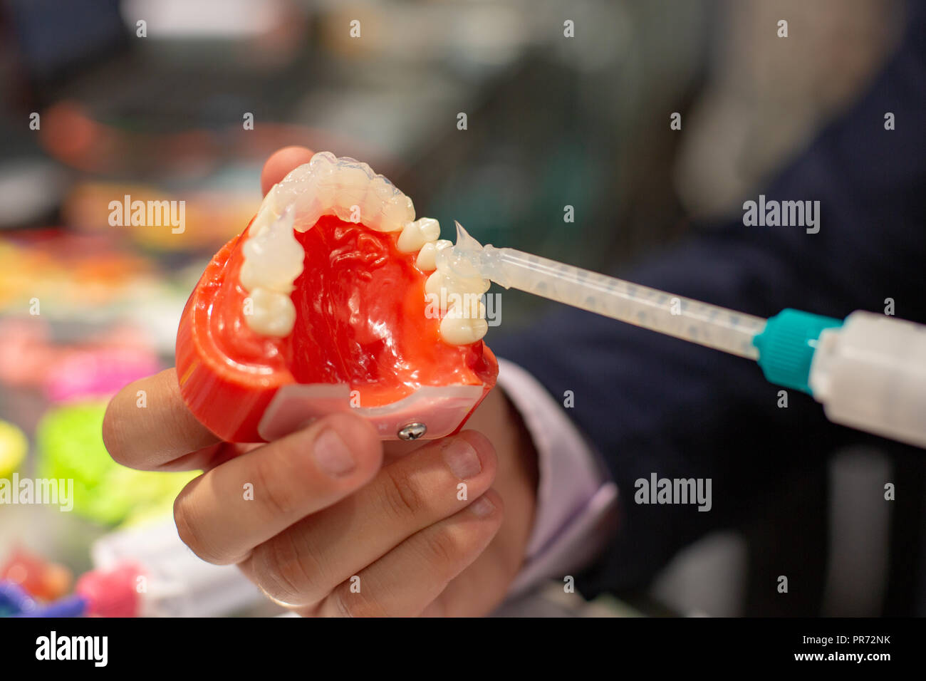 Human dentist practicing work on tooth model Stock Photo - Alamy