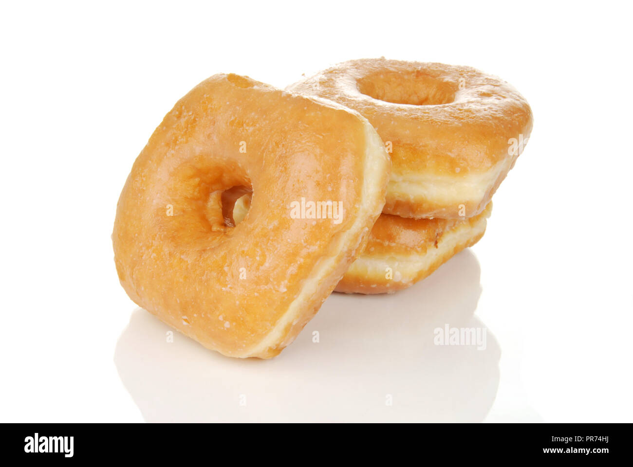 A stack of glazed doughnuts on white Stock Photo - Alamy