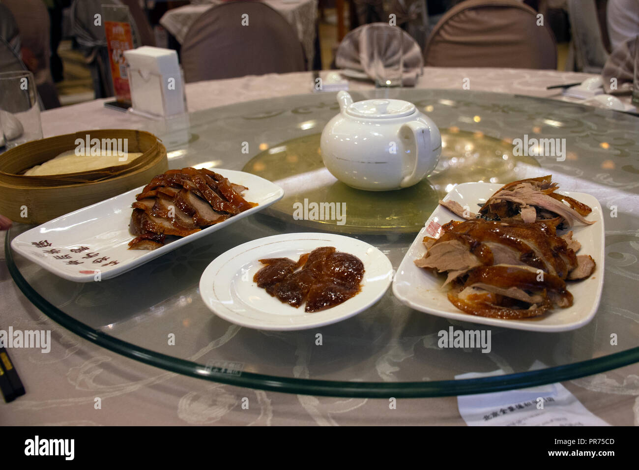 Slices of peking duck served in a restaurant, typical food of Beijing ...