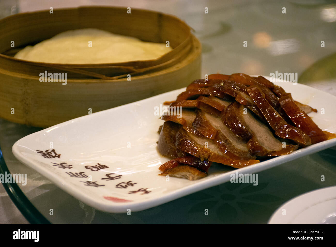 Slices of peking duck served in a restaurant, typical food of Beijing ...
